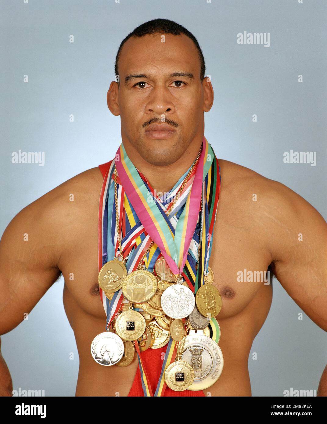 Marine STAFF Sergeant Greg Gibson displays the medals he has won in ...