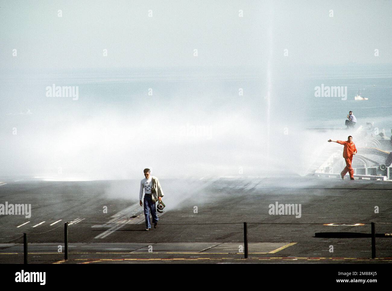 Crewmen test the aqueous film-forming foam (AFFF) firefighting system ...
