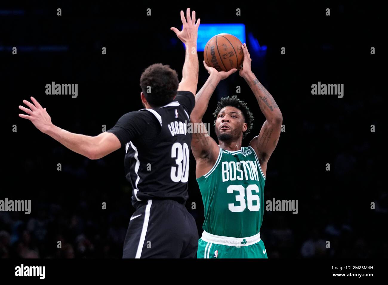 Boston Celtics guard Marcus Smart (36) shoots as Brooklyn Nets guard ...