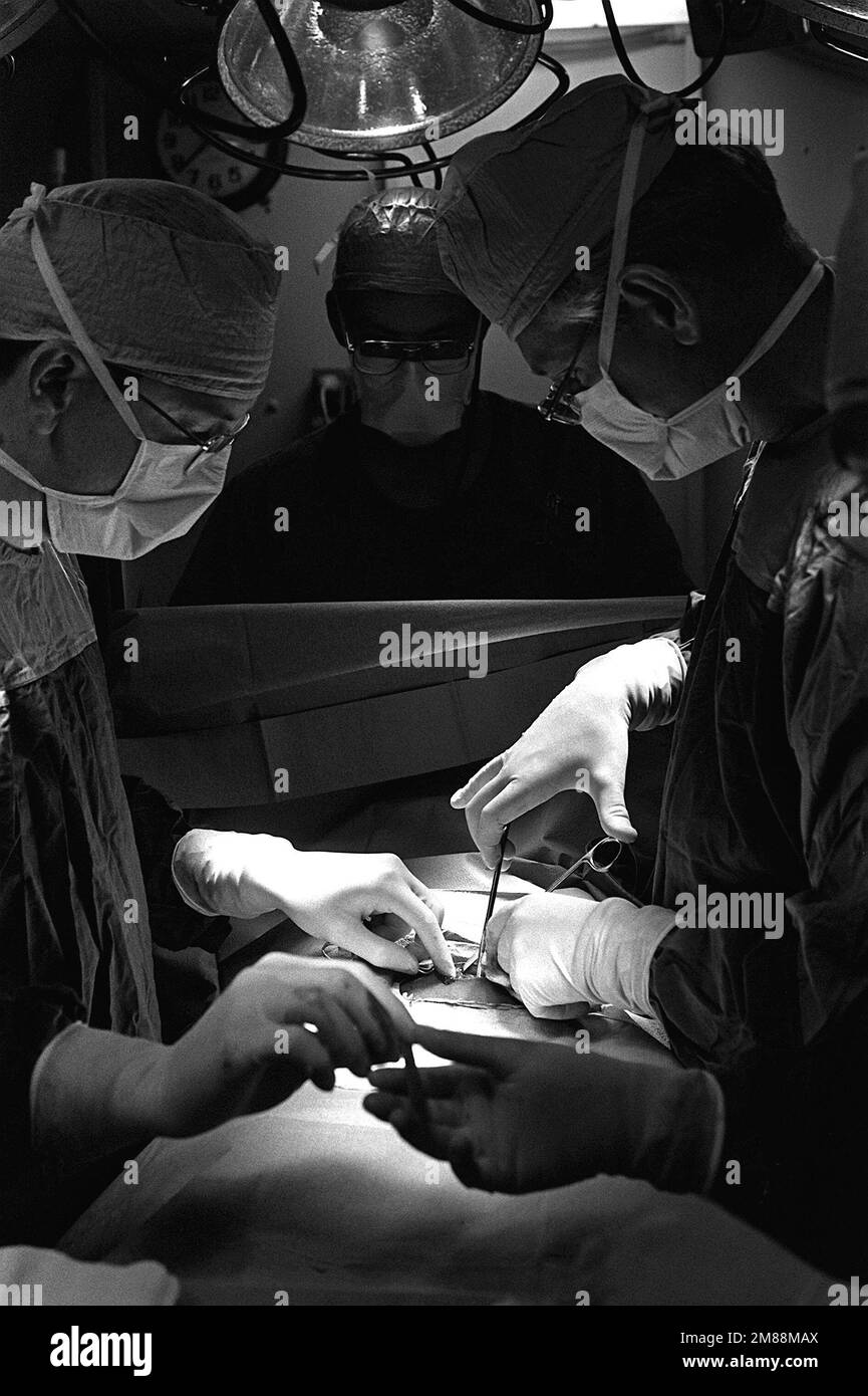 LT. (Dr.) William S. Elwood, left; LT. CMDR. John Hutchins, center ...