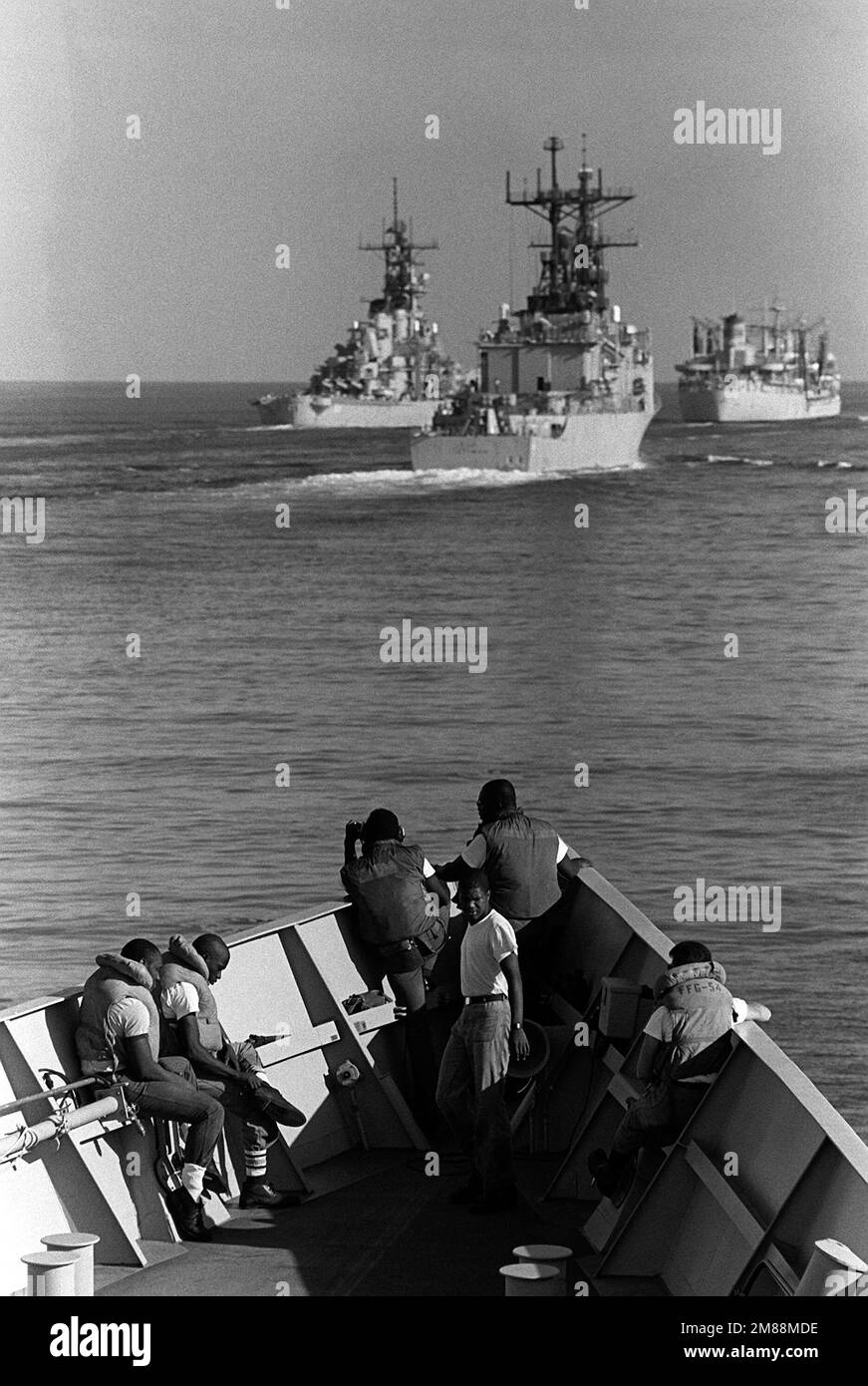 Crew members of the guided missile frigate USS FORD (FFG-54) watch for ...