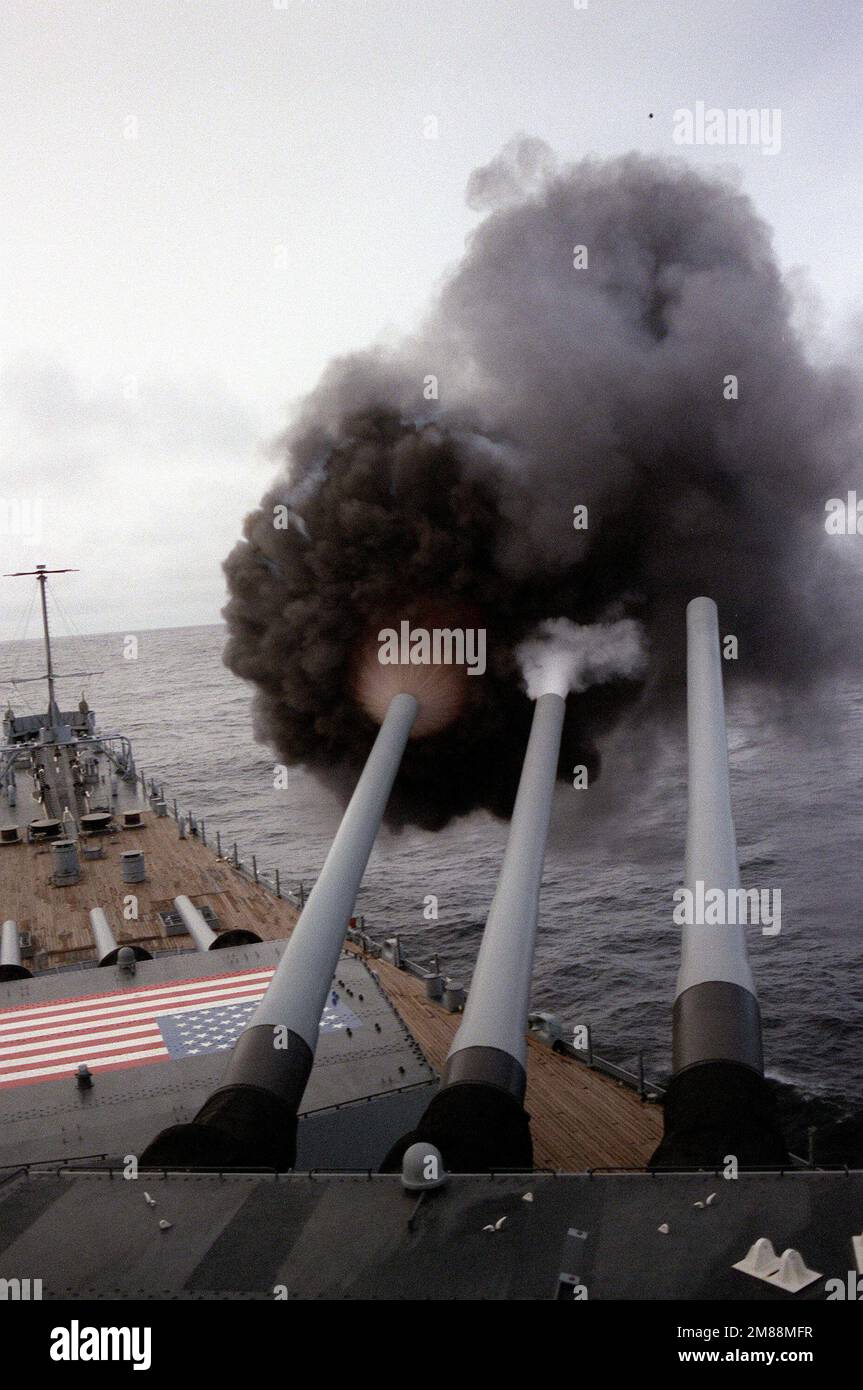 A No. 2 turret Mark 7 16-inch/50-caliber gun is fired off the starboard ...