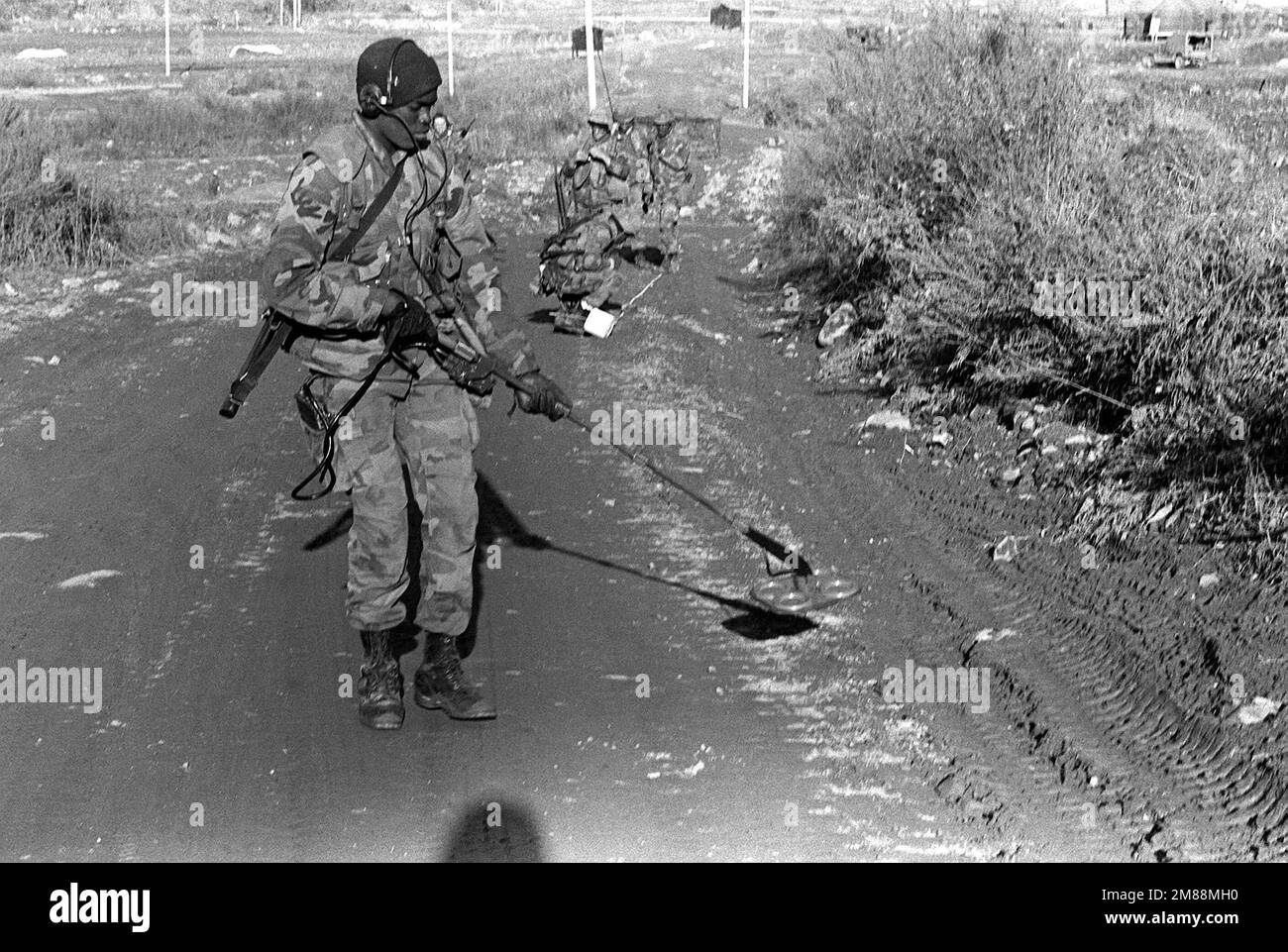 A Marine engineer clears a road of mines during the force-on-force ...