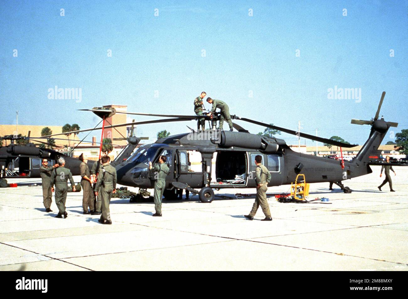 Members of the 101st Airborne Division's Airmobile team ready a UH-60A ...