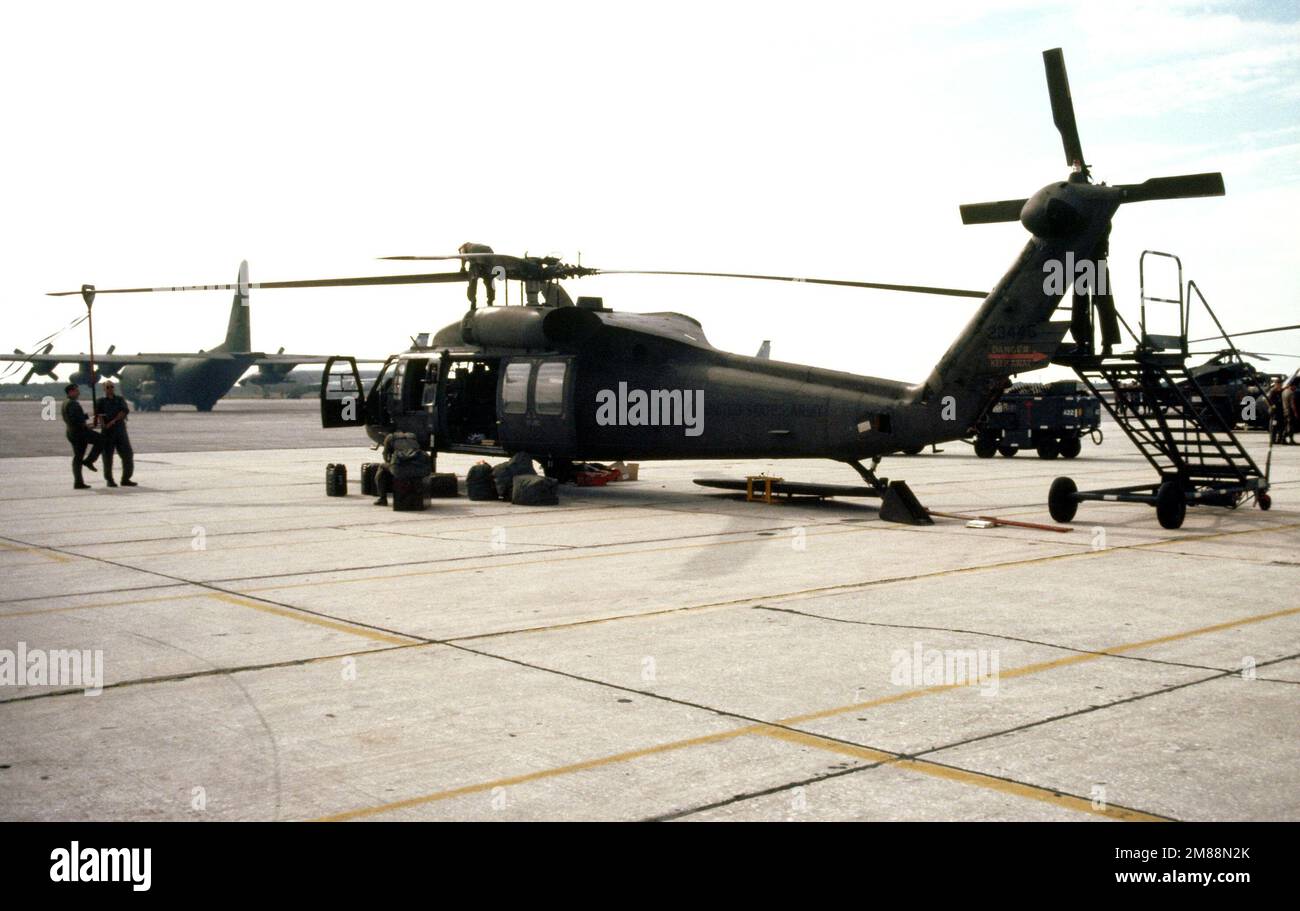 A UH-60 Black Hawk helicopter is serviced on the flight line during ...