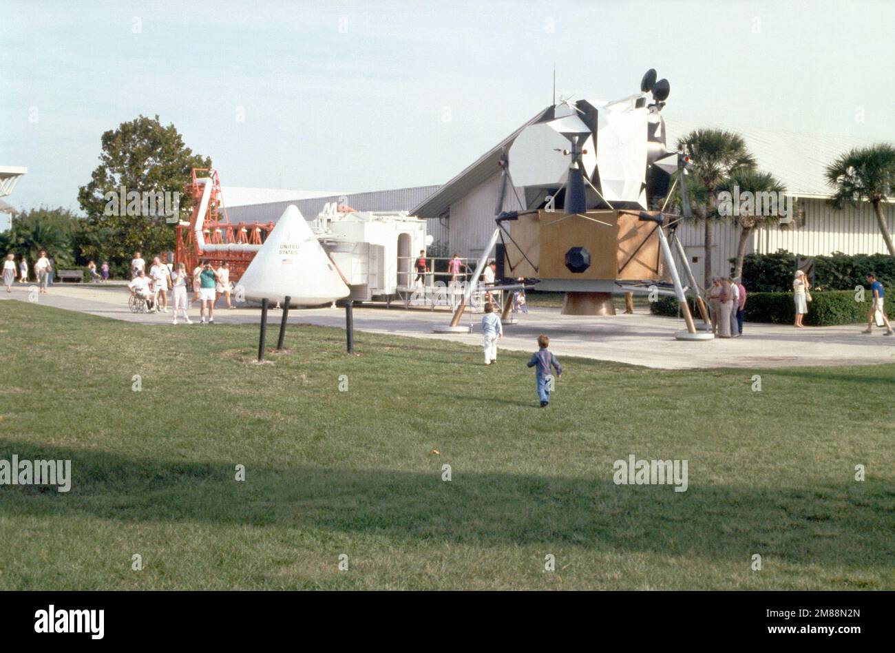 Tourists visit the lunar excursion module. Base: Kennedy Space Center ...