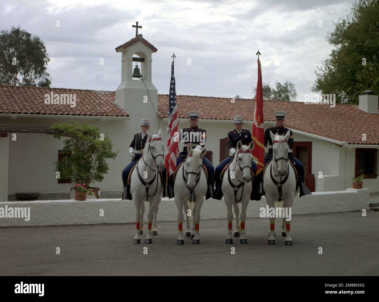 A mounted color guard poses for a photograph in front of the Ranch ...