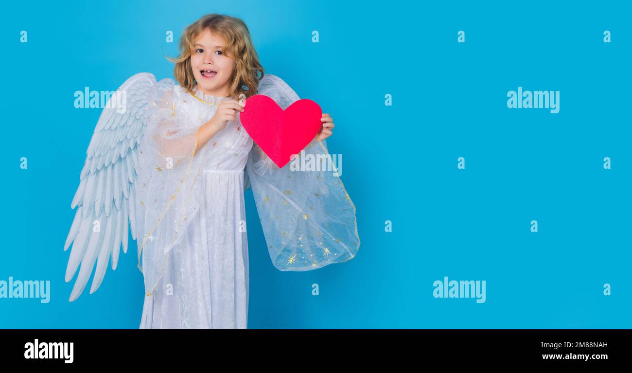 Child with angel wings hold paper heart. Symbol love and valentines day ...