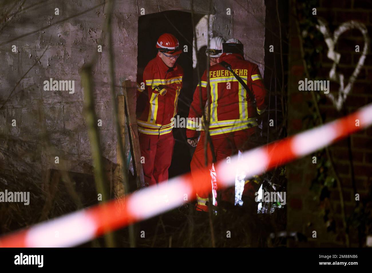 Erkelenz, Germany. 12th Jan, 2023. Rescue workers are standing in front ...