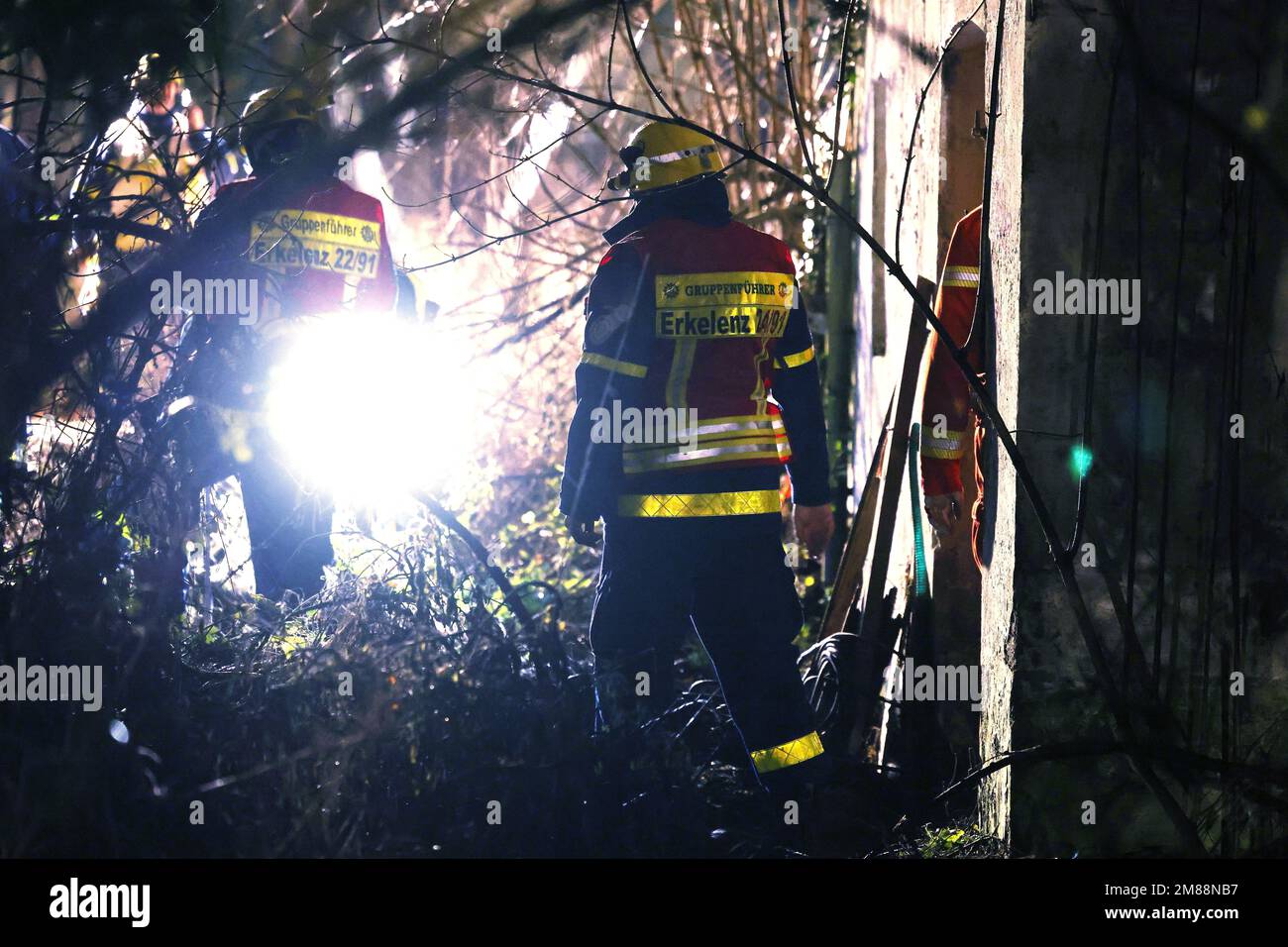 Erkelenz, Germany. 13th Jan, 2023. Rescue workers are standing in front ...