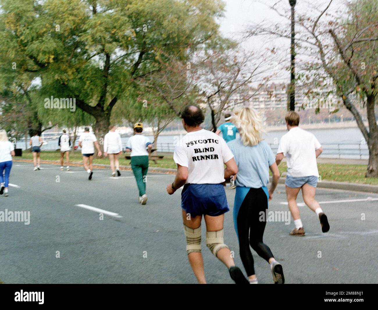 A blind runner and his guide pass near Hains Point during the 1987 ...