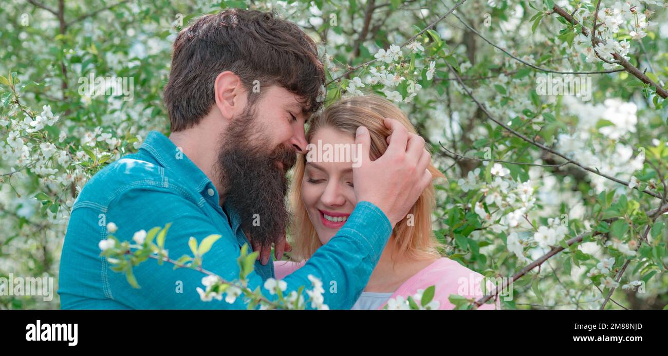 Couple in love, spring banner. Kissing couple in spring nature close-up ...