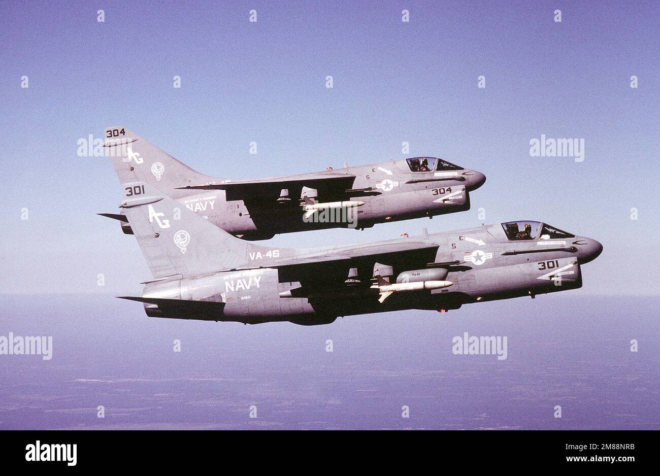 An air-to-air right side view of a pair of Attack Squadron 46 (VA-46) A ...