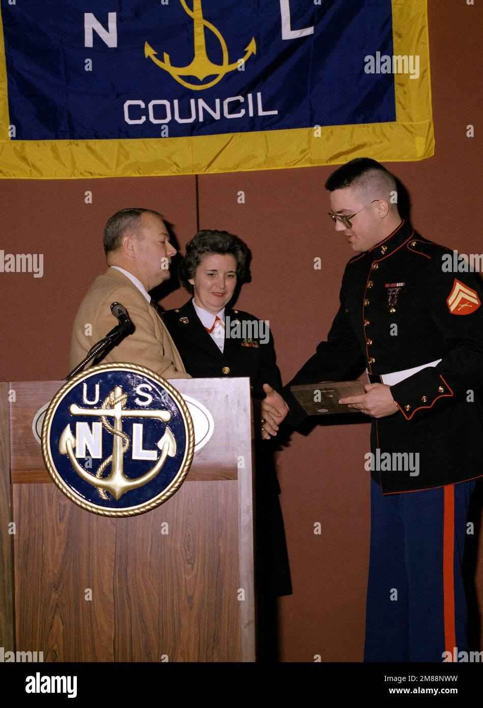 Thomas Cleven, Chairman of the Navy League, Richmond Chapter, presents ...