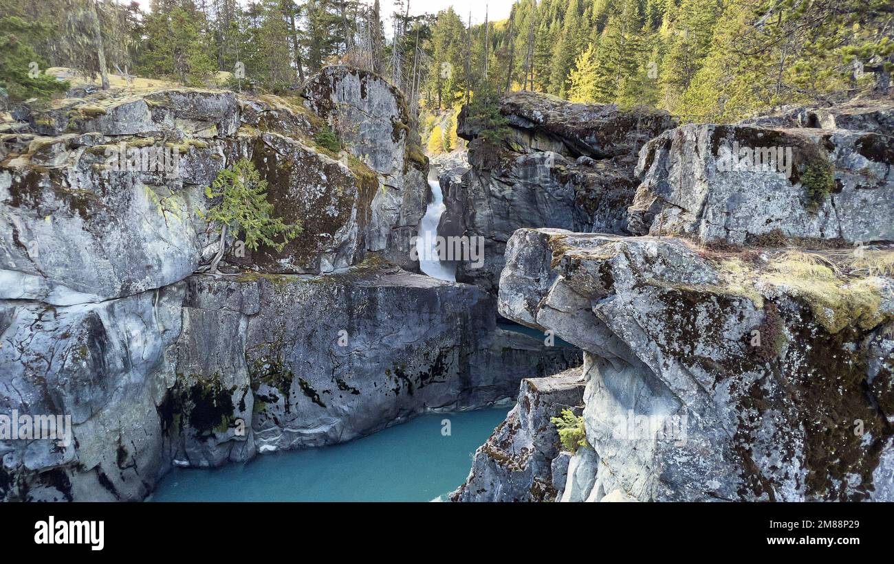 A breathtaking view of a waterfall and the Green River of Nairn Falls ...