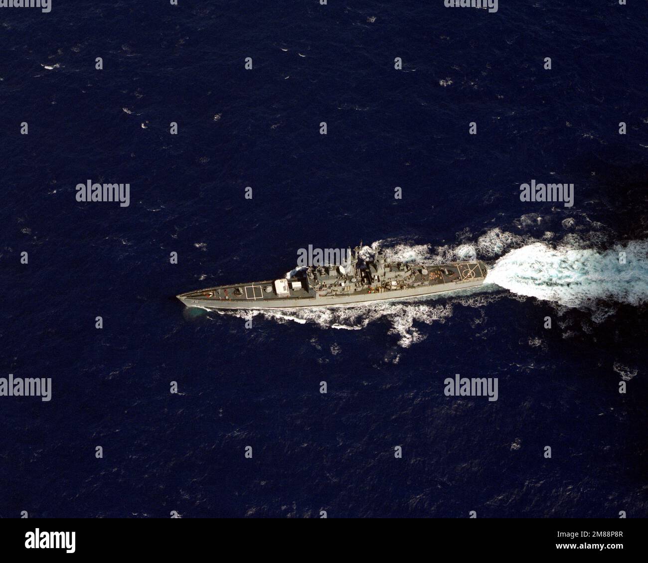 An aerial port view of the nuclear-powered guided missile cruiser USS ...