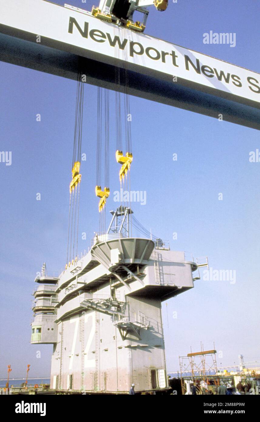 The ship's island structure, a single modular unit, is lowered into ...
