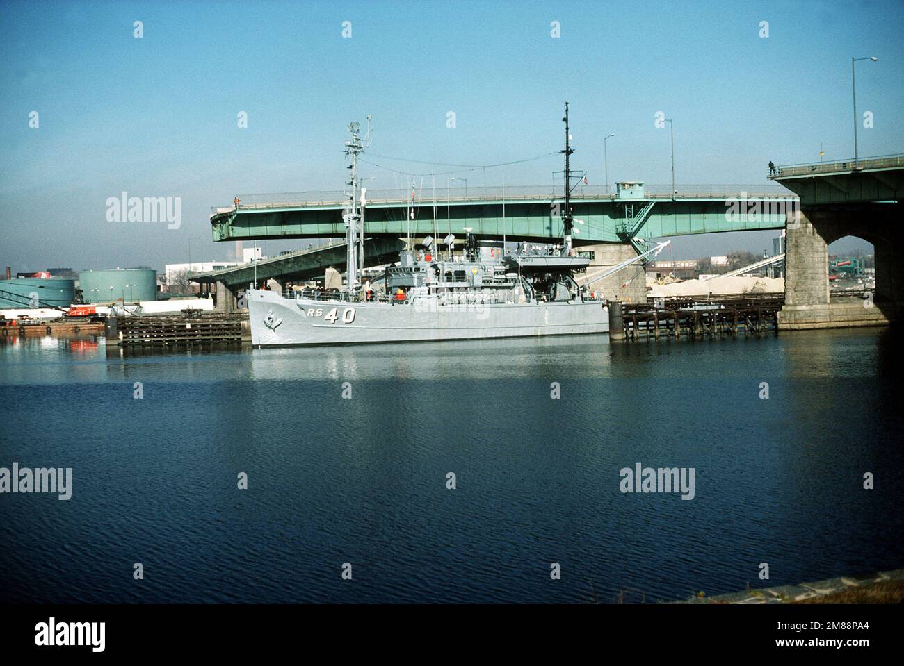 A port bow view of the salvage ship USS HOIST (ARS-40) passing through ...