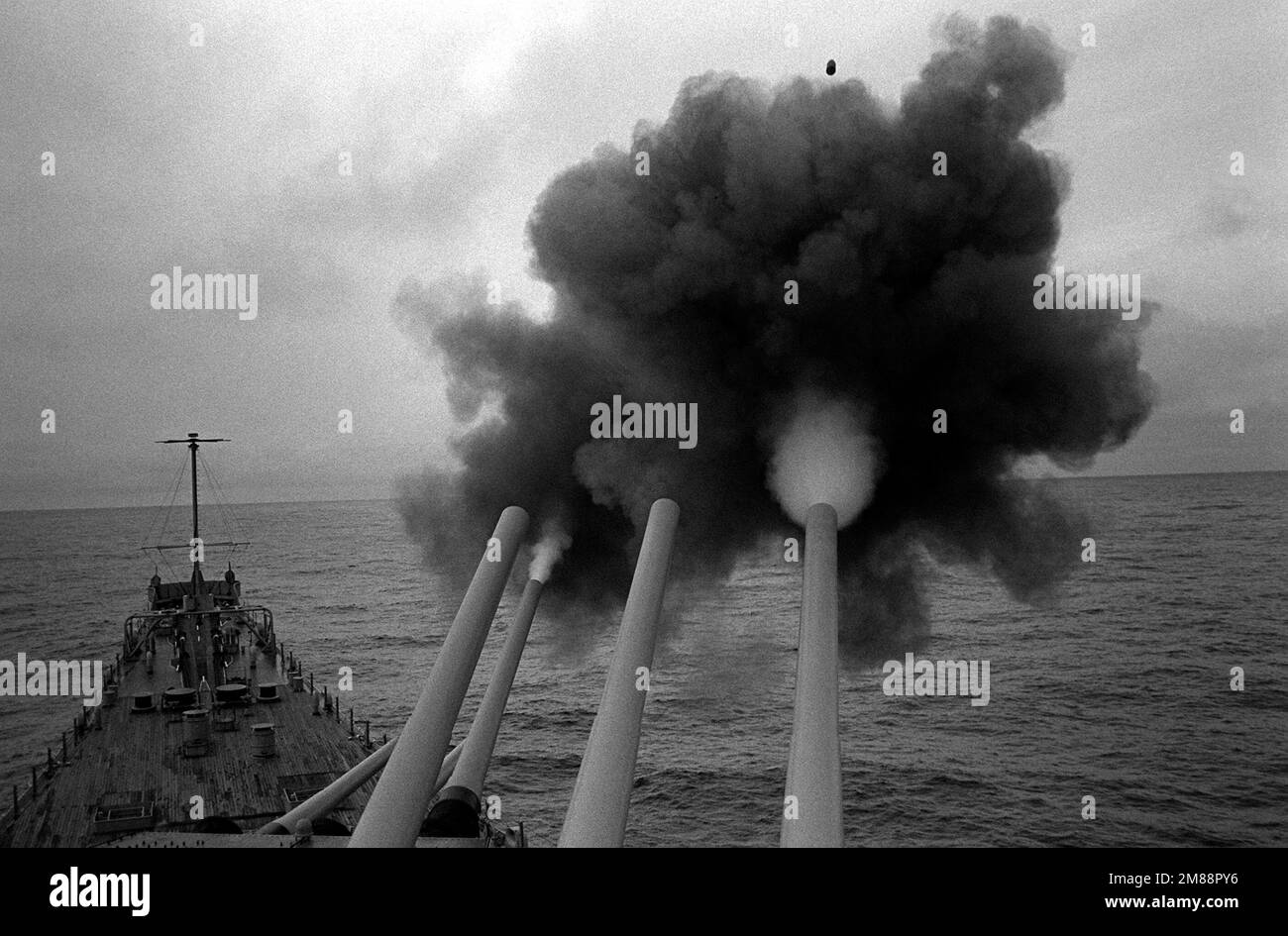 The battleship USS IOWA (BB-61) fires its Nos. 1 and 2 Mark 16-inch/50 ...