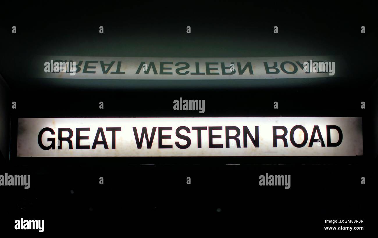 Great Western Road bus stop sign illuminated and reflected Stock Photo ...