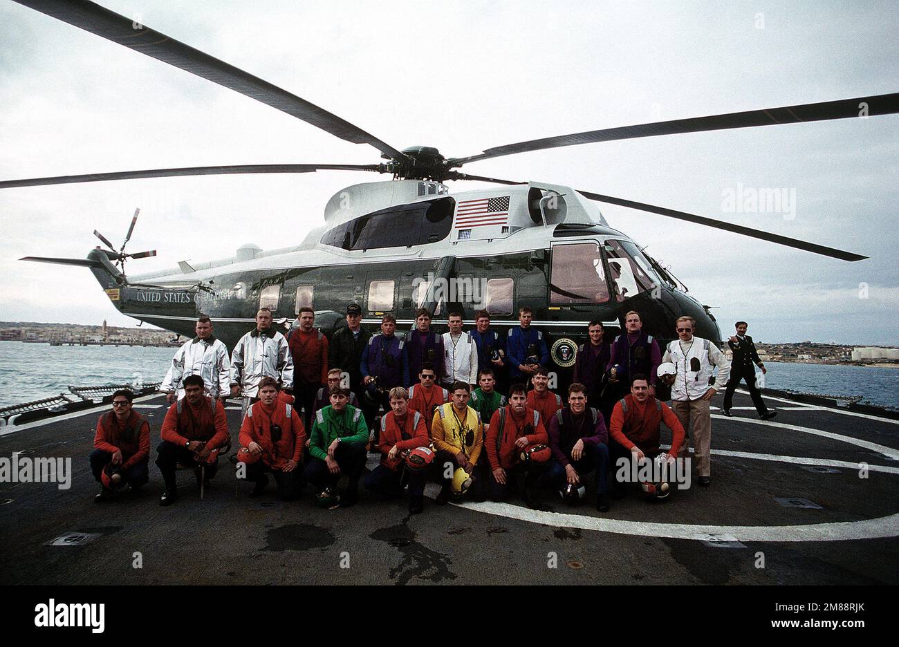 Members of Marine Helicopter Squadron One (HMX-1) pose in front of their VH-3D Sea King ...