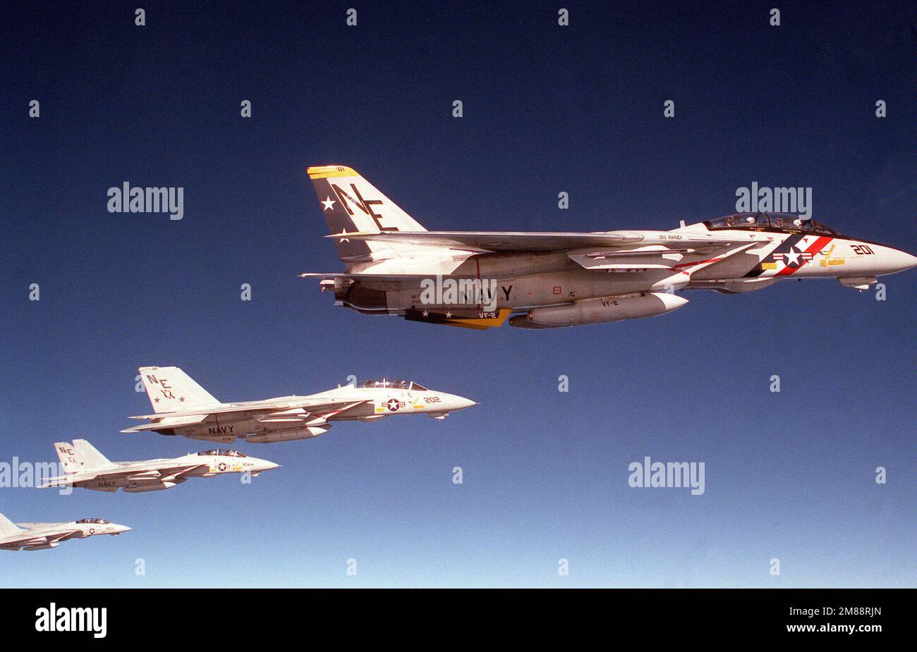 Four Fighter Squadron 2 (VF-2) F-14A Tomcat aircraft fly in formation ...
