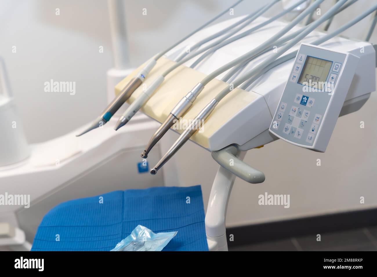 Tools used by doctors in a modern dental clinic next to the chair for ...