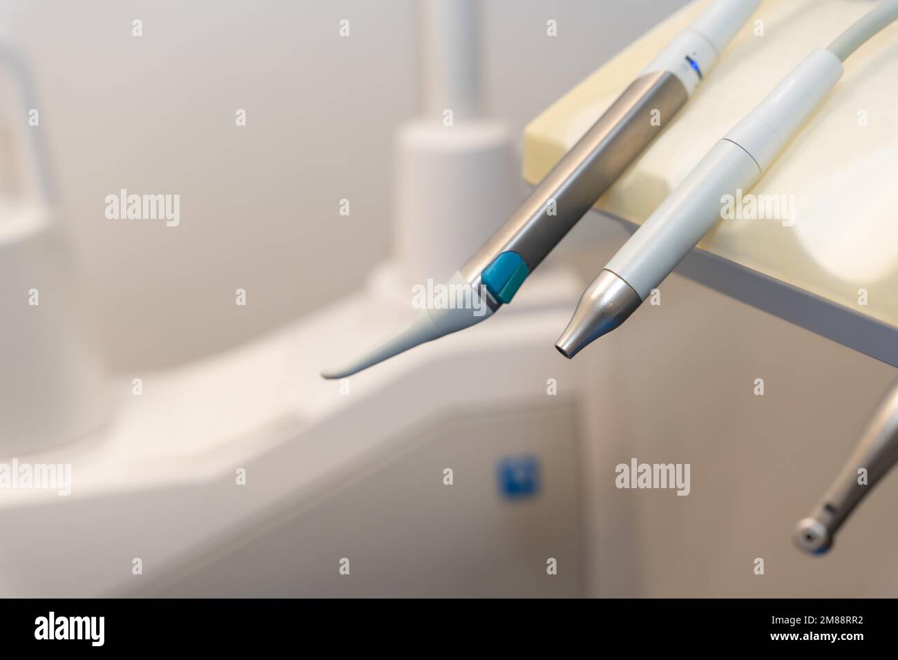 Tools used by doctors in a modern dental clinic next to the chair for ...