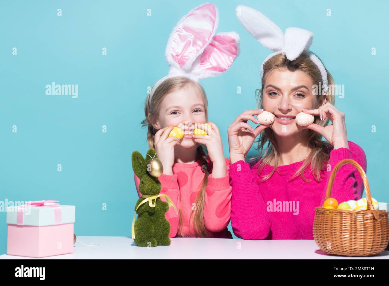 Ester for mother and daughter. Family easter. Mom with child girl are ...