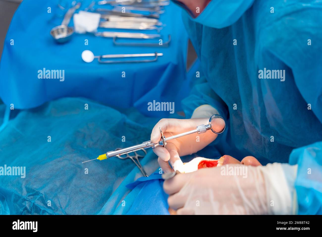 Dental clinic, dentist doctor applying anesthesia injection to patient ...