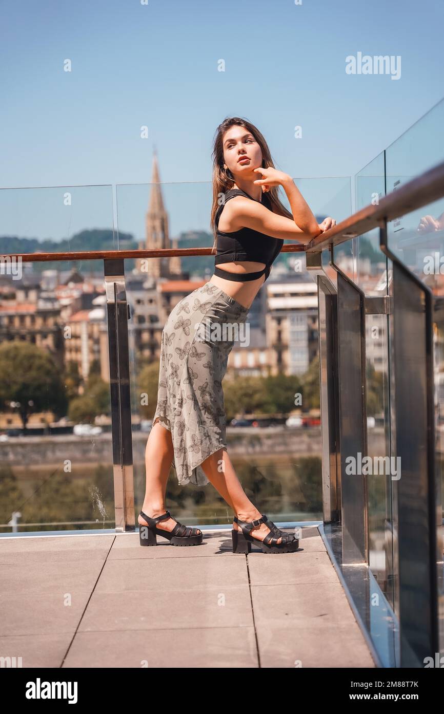 Girl looking over railing hi-res stock photography and images - Alamy