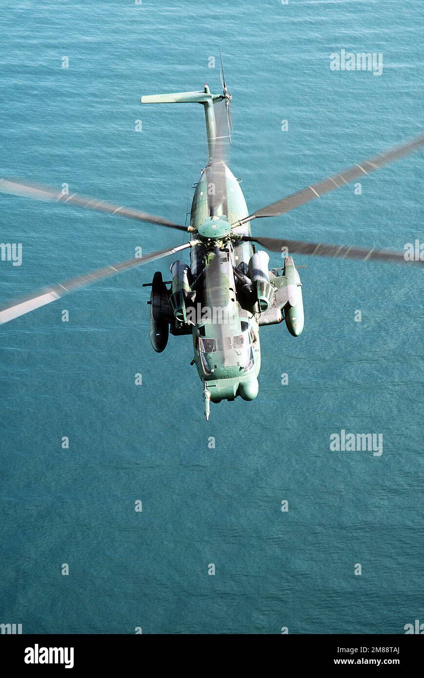 An air-to-air overhead front view of an MH-53H Pave Low III helicopter ...