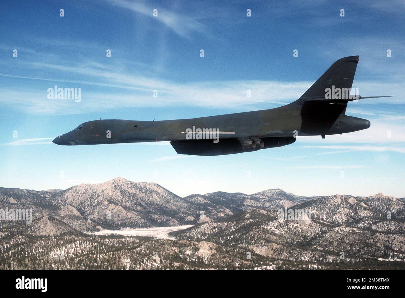 An air-to-air left side view of a B-1B bomber during an acceptance ...