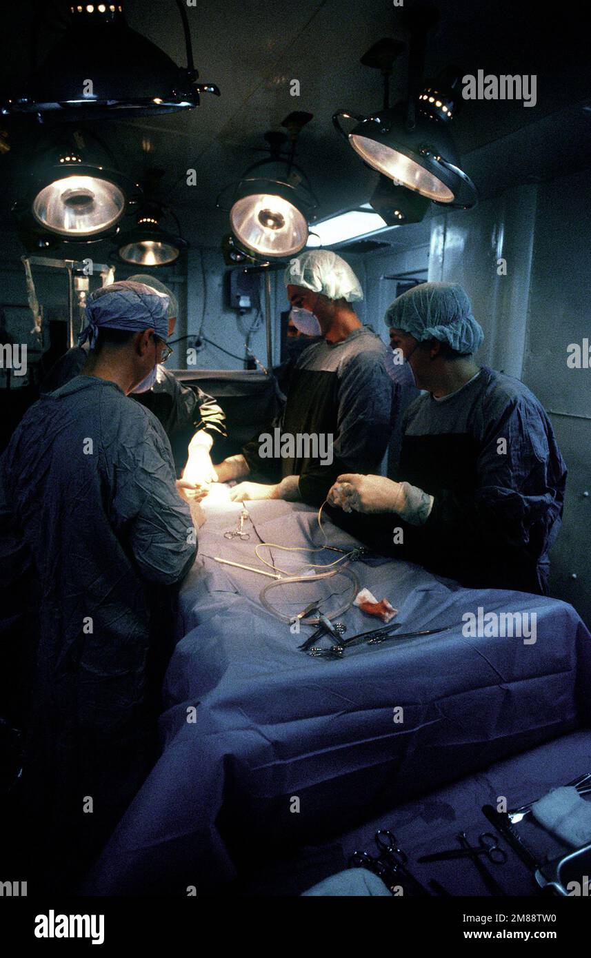 Surgical Support Team members Dr. David R. Racicot, an appendectomy on ...