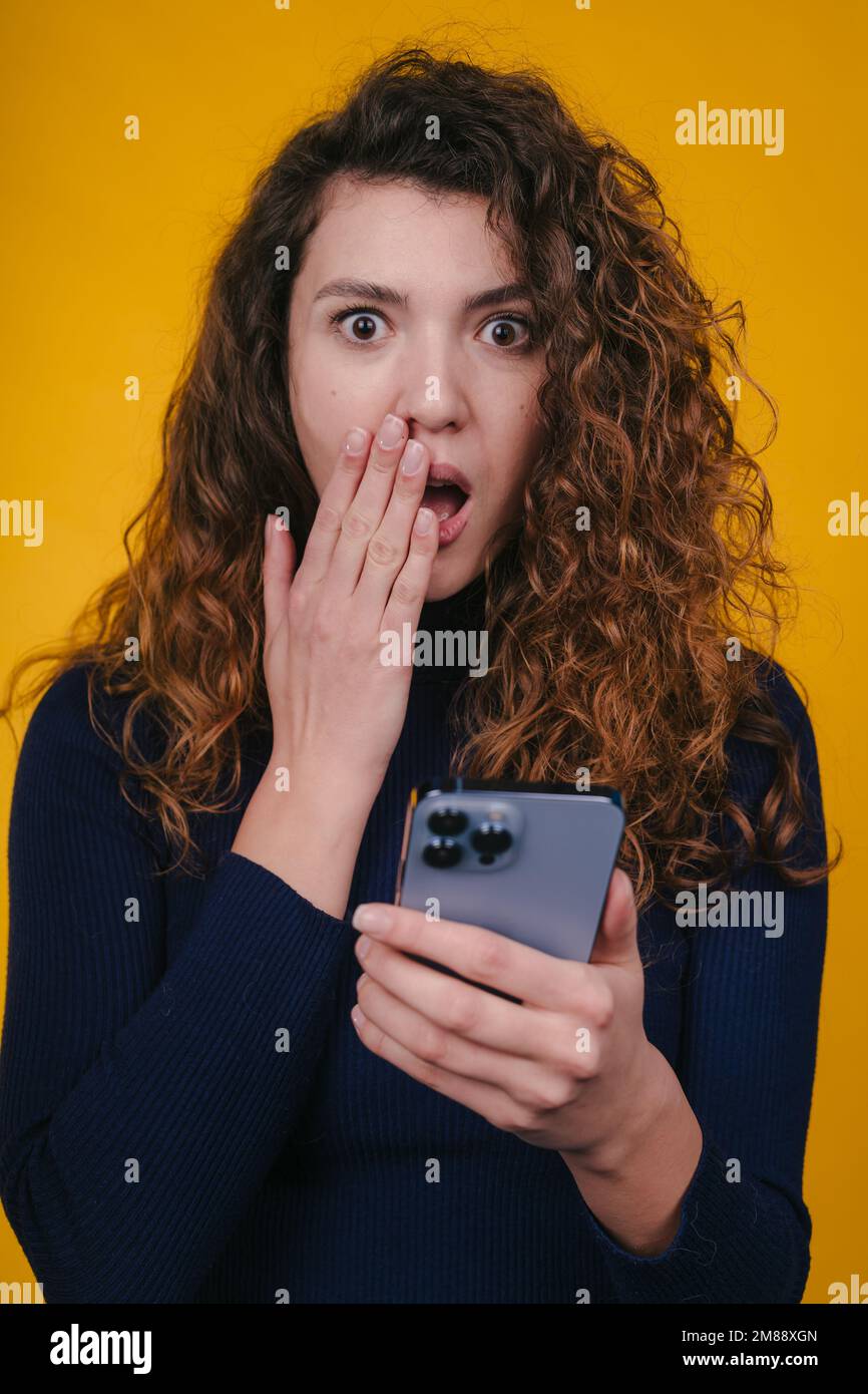 Image Of A Beautiful Shocked Young Curly Haired Woman Posing Isolated