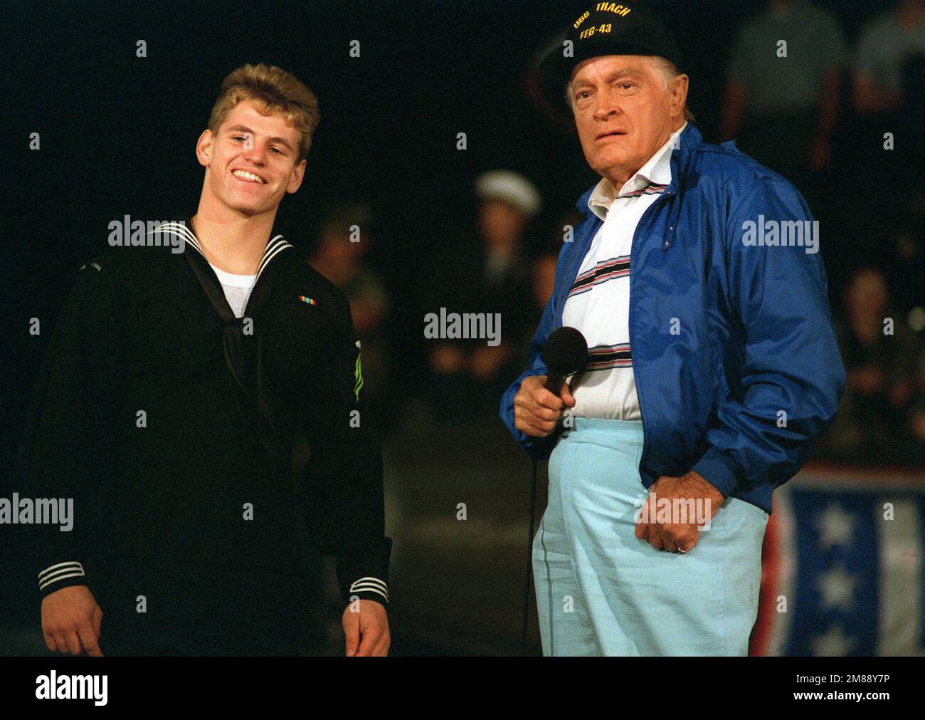 Entertainer Bob Hope clowns with a sailor during his United Services ...