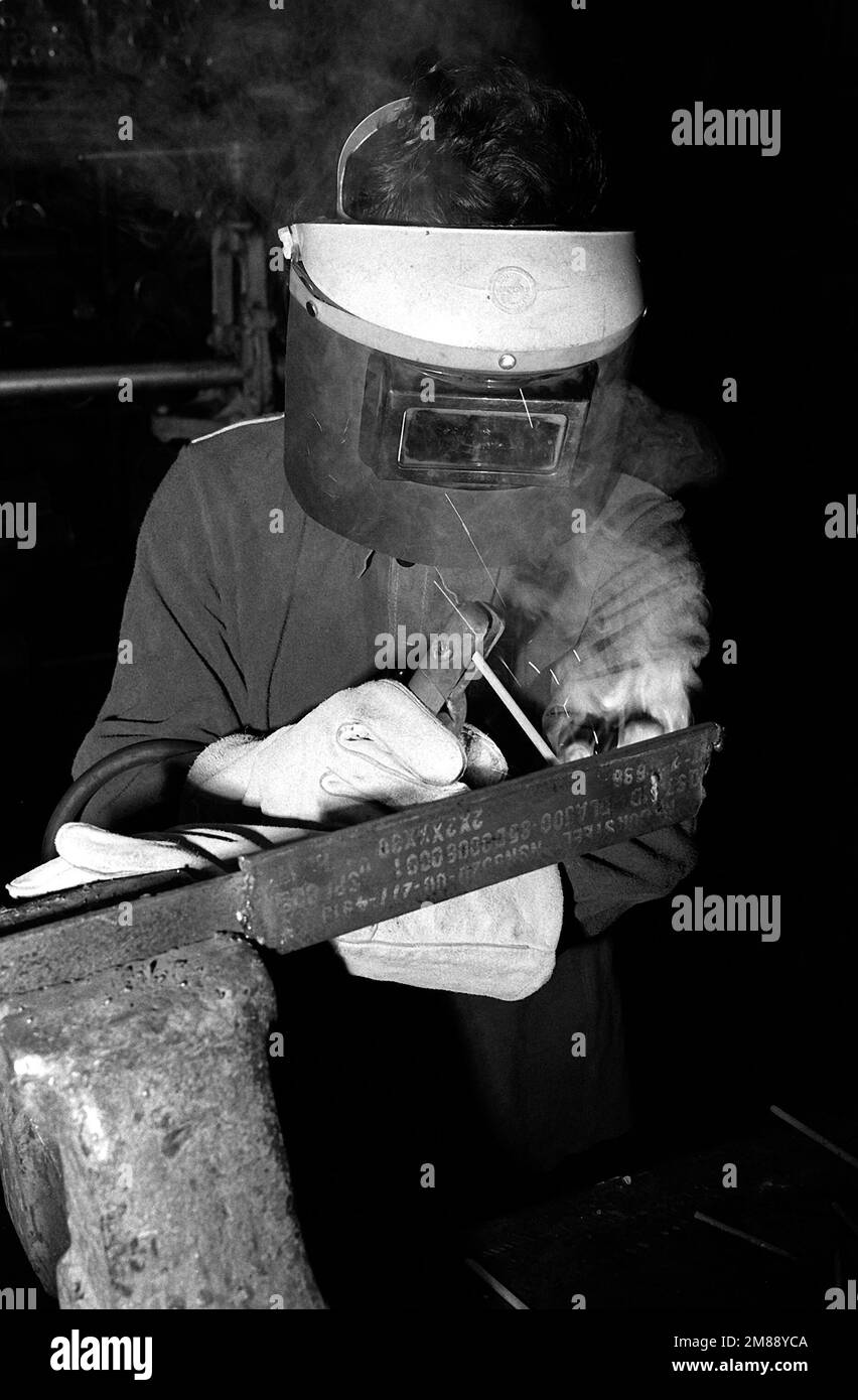 Fireman Apprentice Pam Grey practices using an arc welder to fuse metal ...