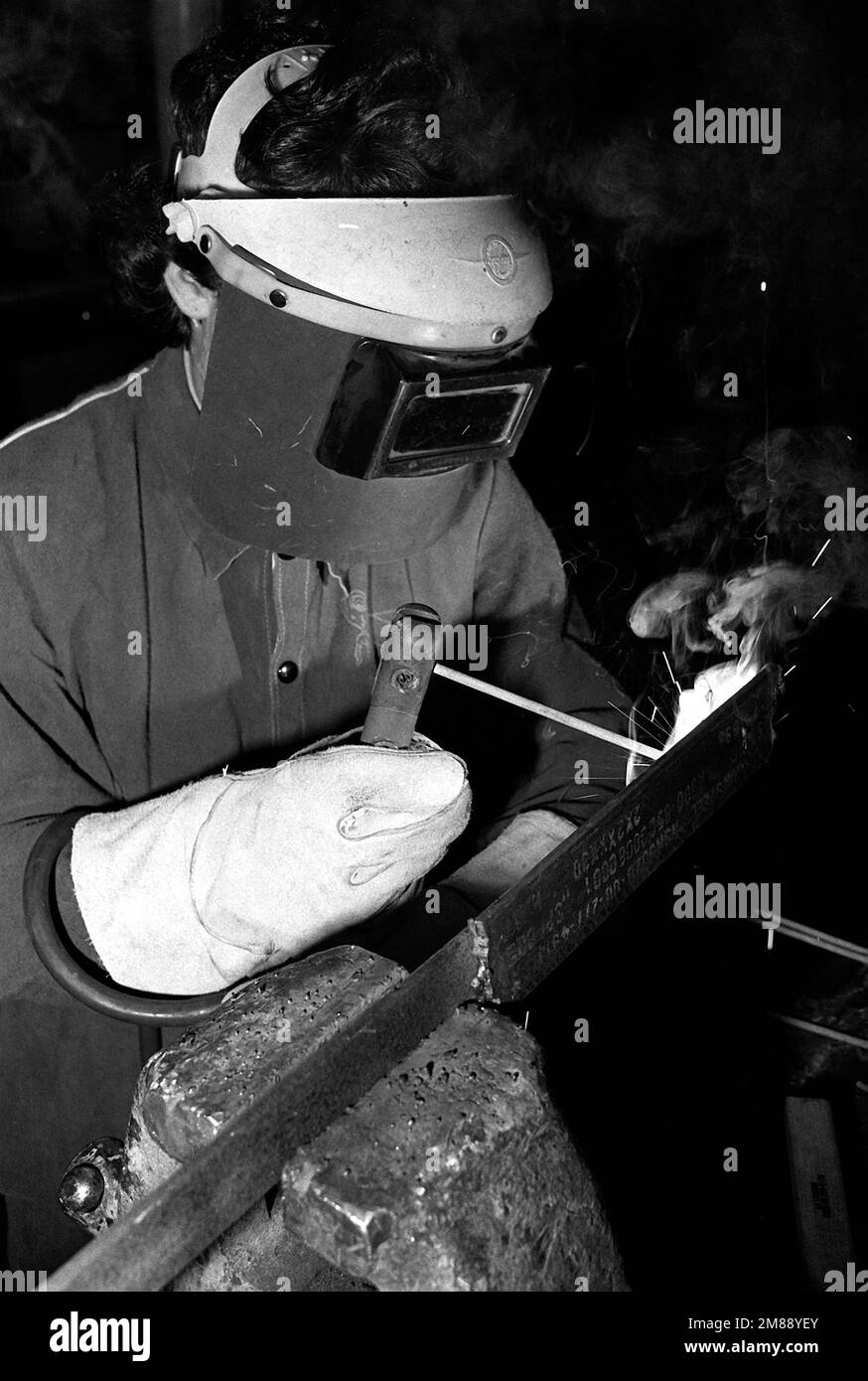 Fireman Apprentice Pam Grey practices using an arc welder to fuse metal ...