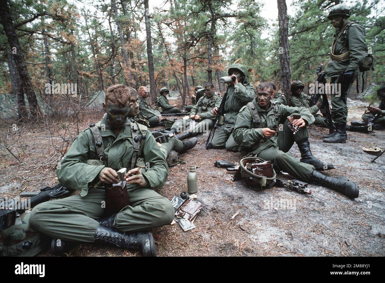 Security Police personnel take a lunch break, of Meals Ready to Eat ...
