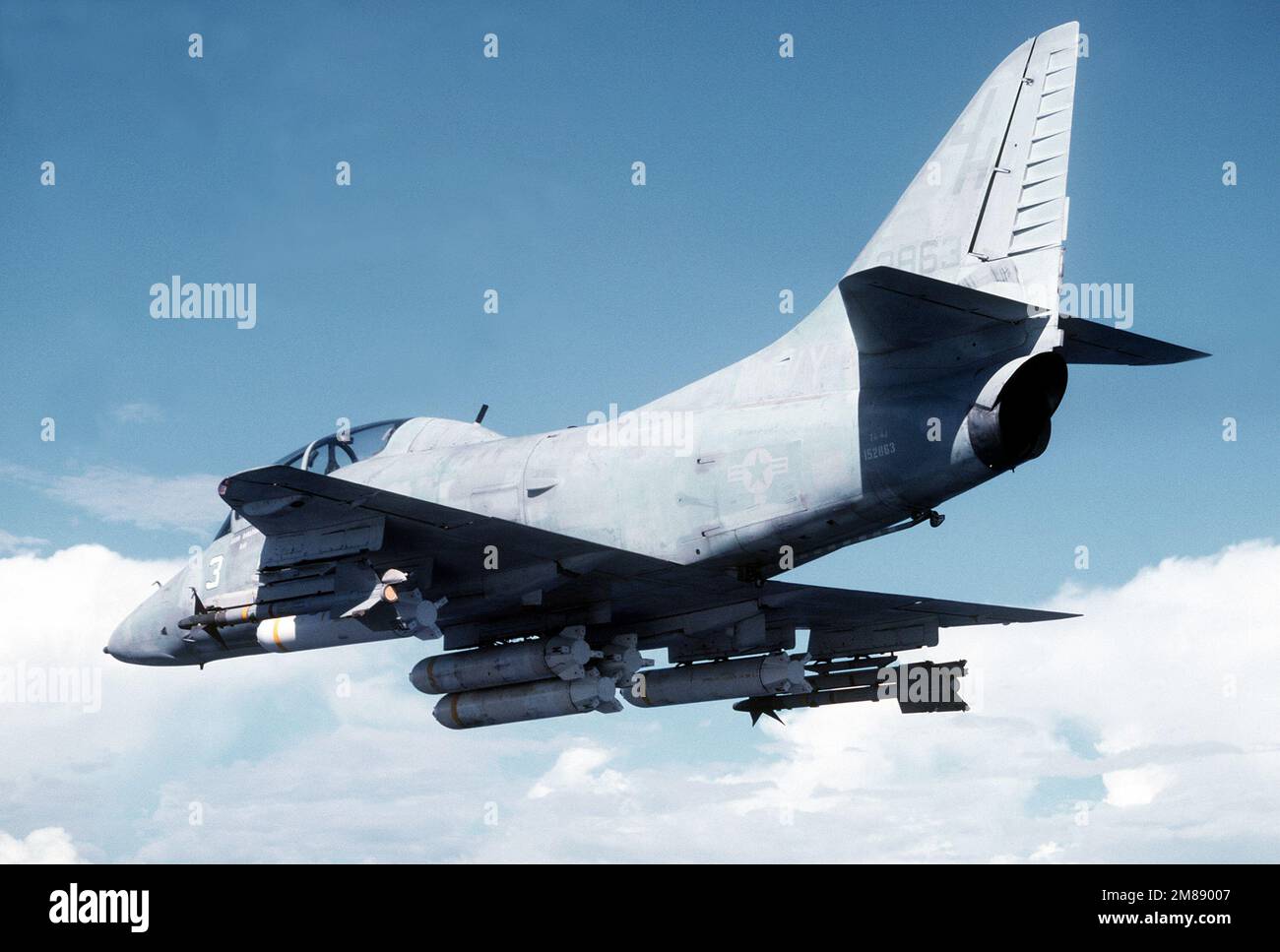 An air-to-air left side view of a Fleet Composite Squadron 10 (VC-10) TA-4J Skyhawk aircraft ...