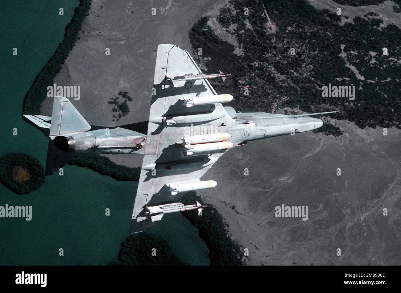 A Fleet Composite Squadron 10 (VC-10) TA-4J Skyhawk aircraft banks over ...