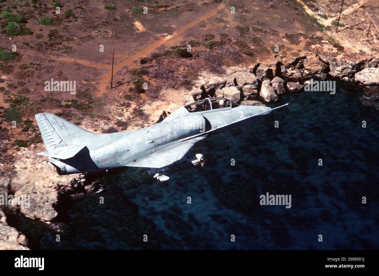 A Fleet Composite Squadron 10 (VC-10) TA-4J Skyhawk aircraft flies ...