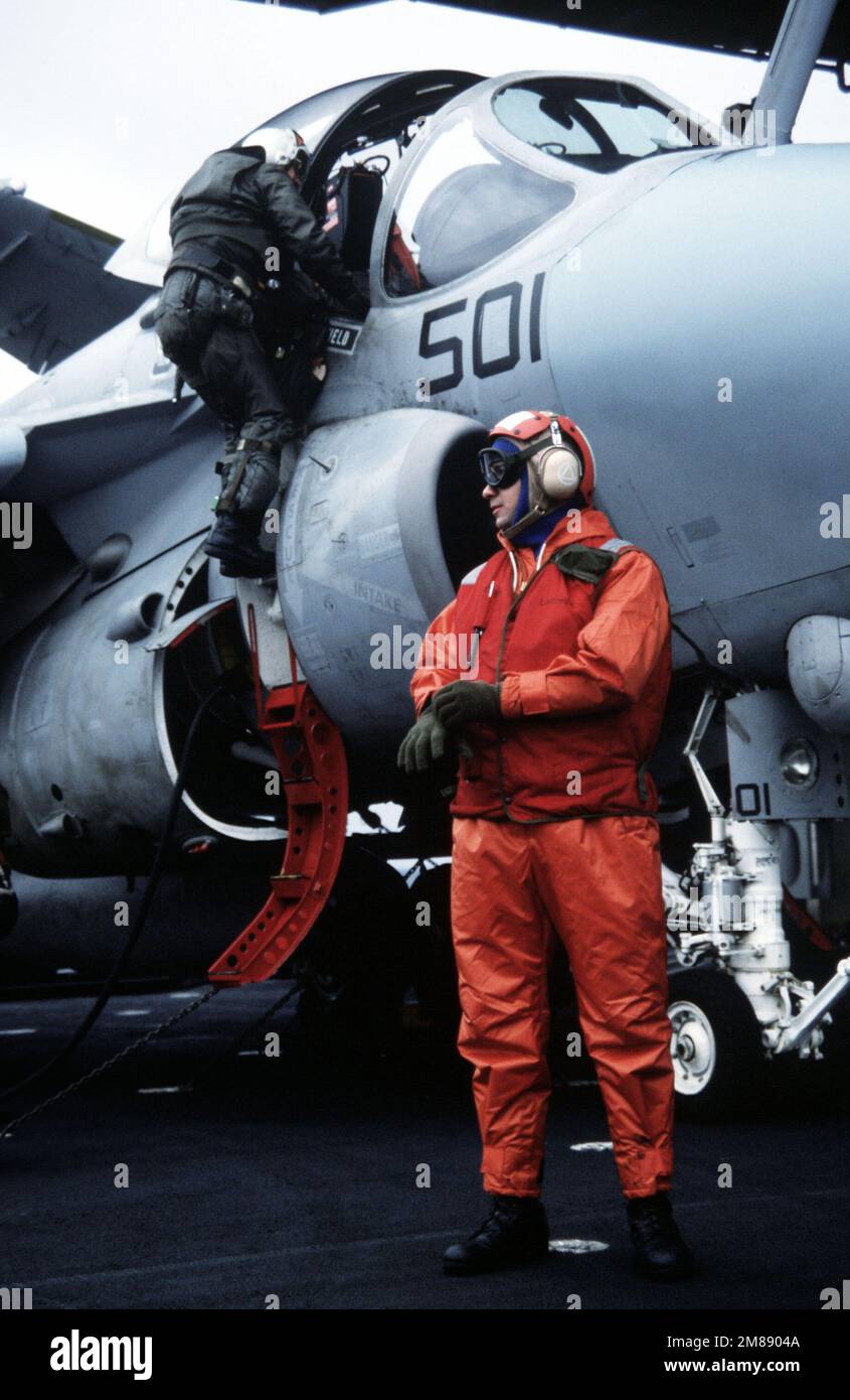 An Attack Squadron 95 (VA-95) bombardier/navigator climbs up into the ...