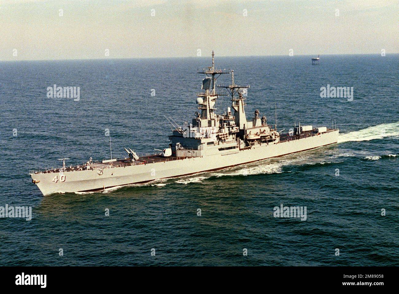 A port bow view of the nuclear-powered guided missile cruiser USS ...