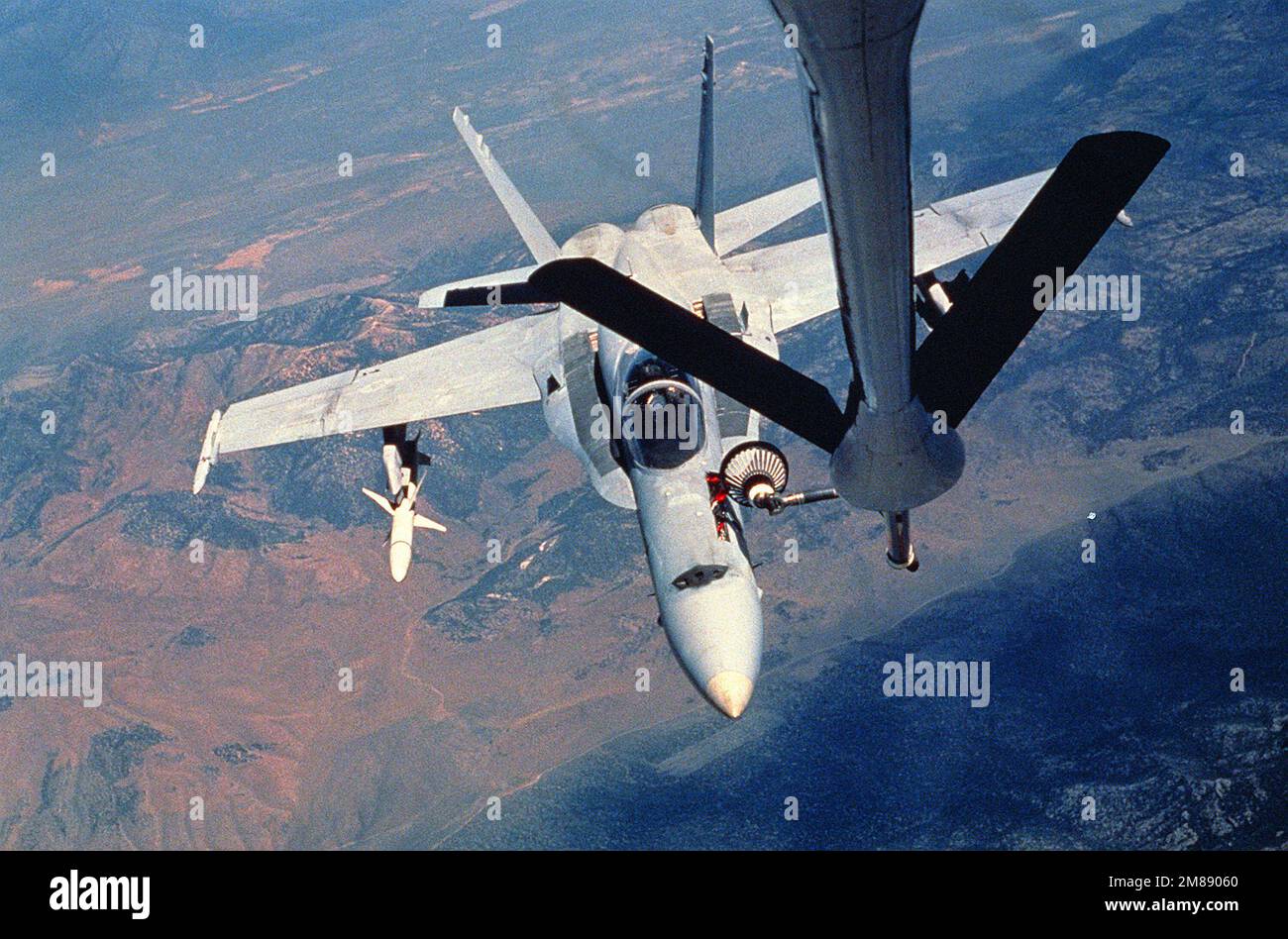 An F/A-18 Hornet aircraft armed with an AGM-88 High-speed Anti ...