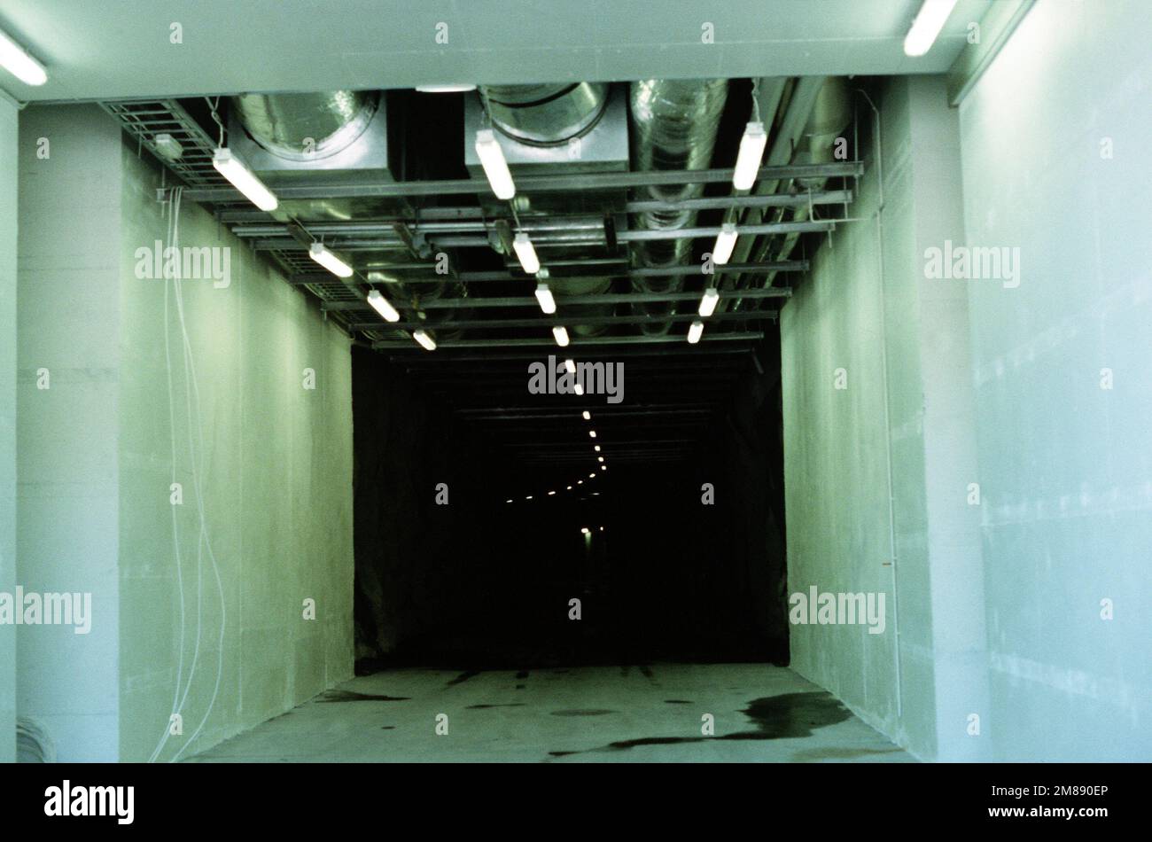 Ventilation pipes and support structures line a pre-positioning cave ...