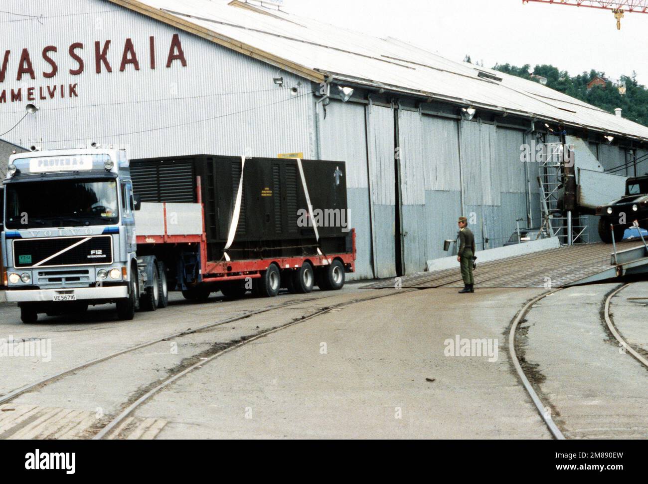 A truck transporting containers, part of a shipment of U.S. Marine ...