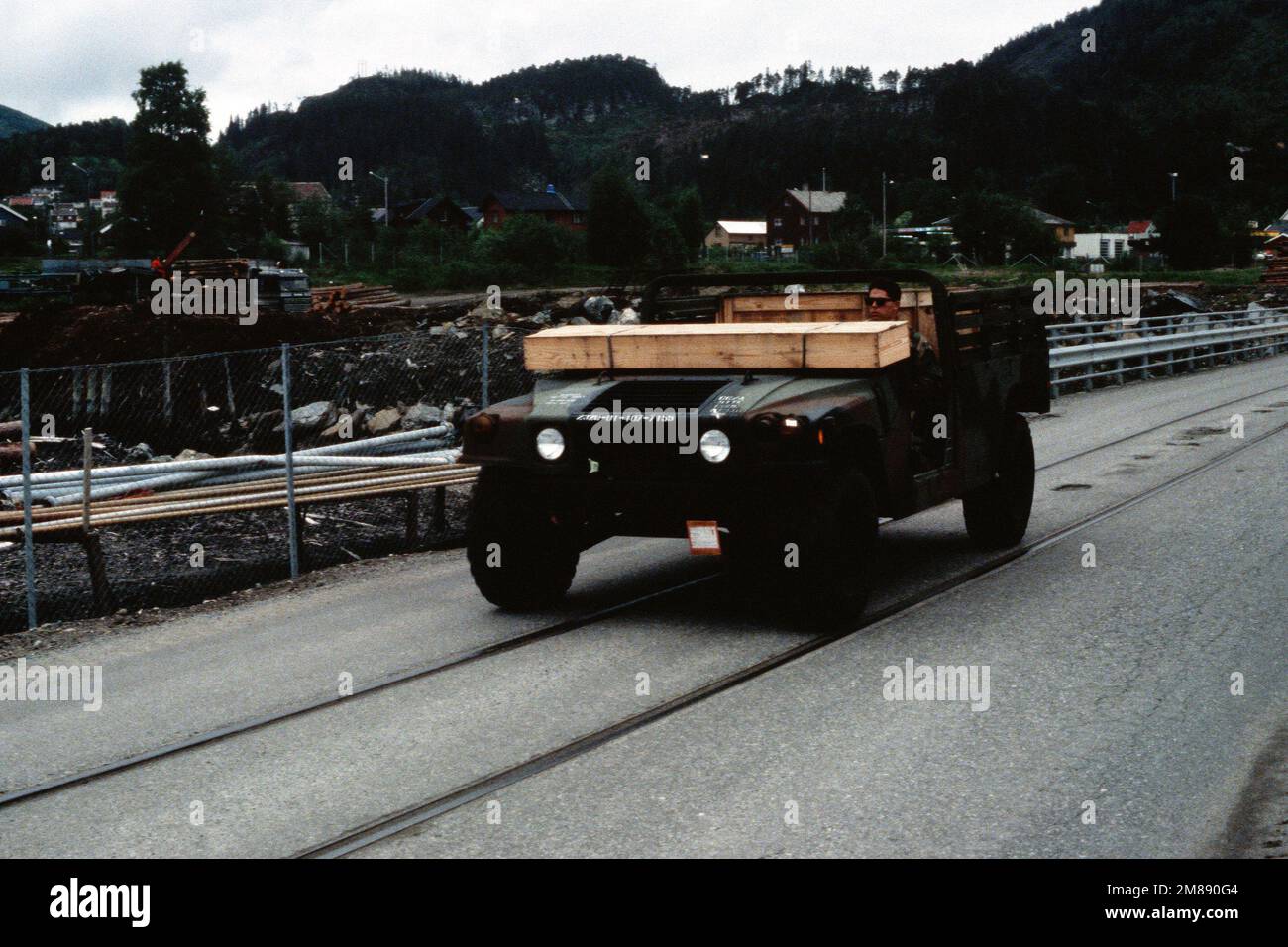 A U.S. Marine drives an M998 High-Mobility Multipurpose Wheeled ...