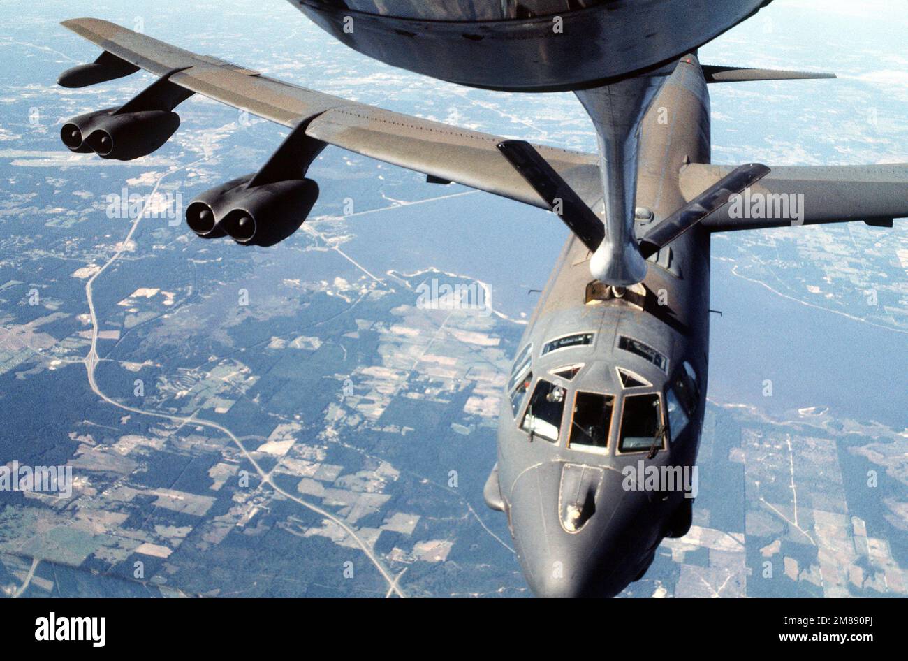 B-52 aircraft from the 596th Bombardment Squadron is refueled in flight ...