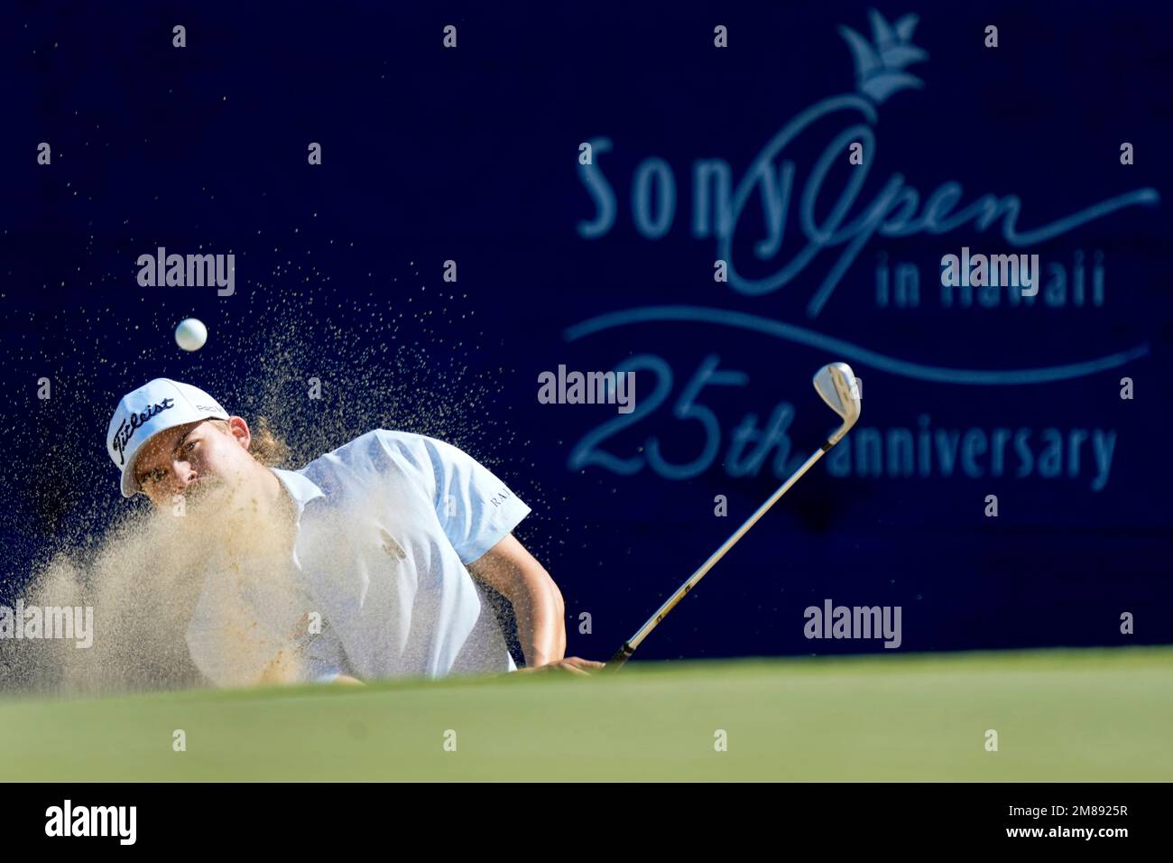 Carson Young hits from the bunker on the 18th green during the first ...